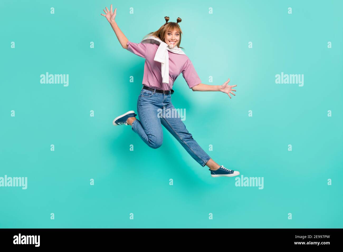 Full body photo of young excited girl happy positive smile jump up wave ...