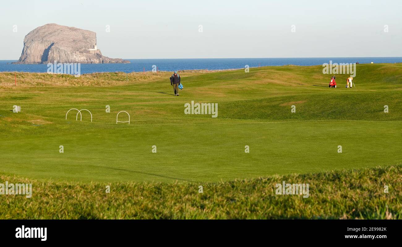 Golfers on East Links Golf Course, North Berwick - Bass Rock behind ...