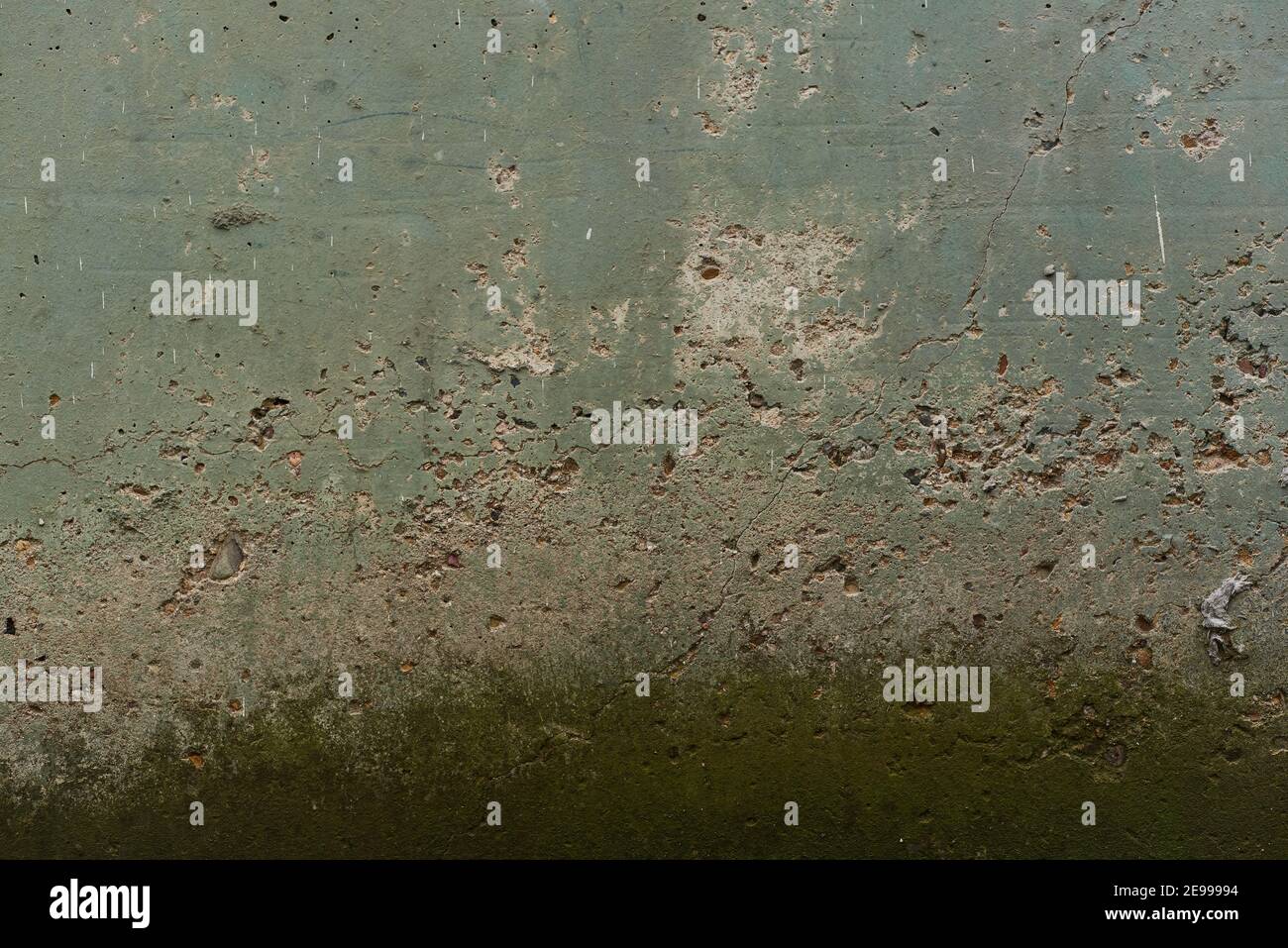 Green moss on wall with cracks scratches and black brush strokes old ...