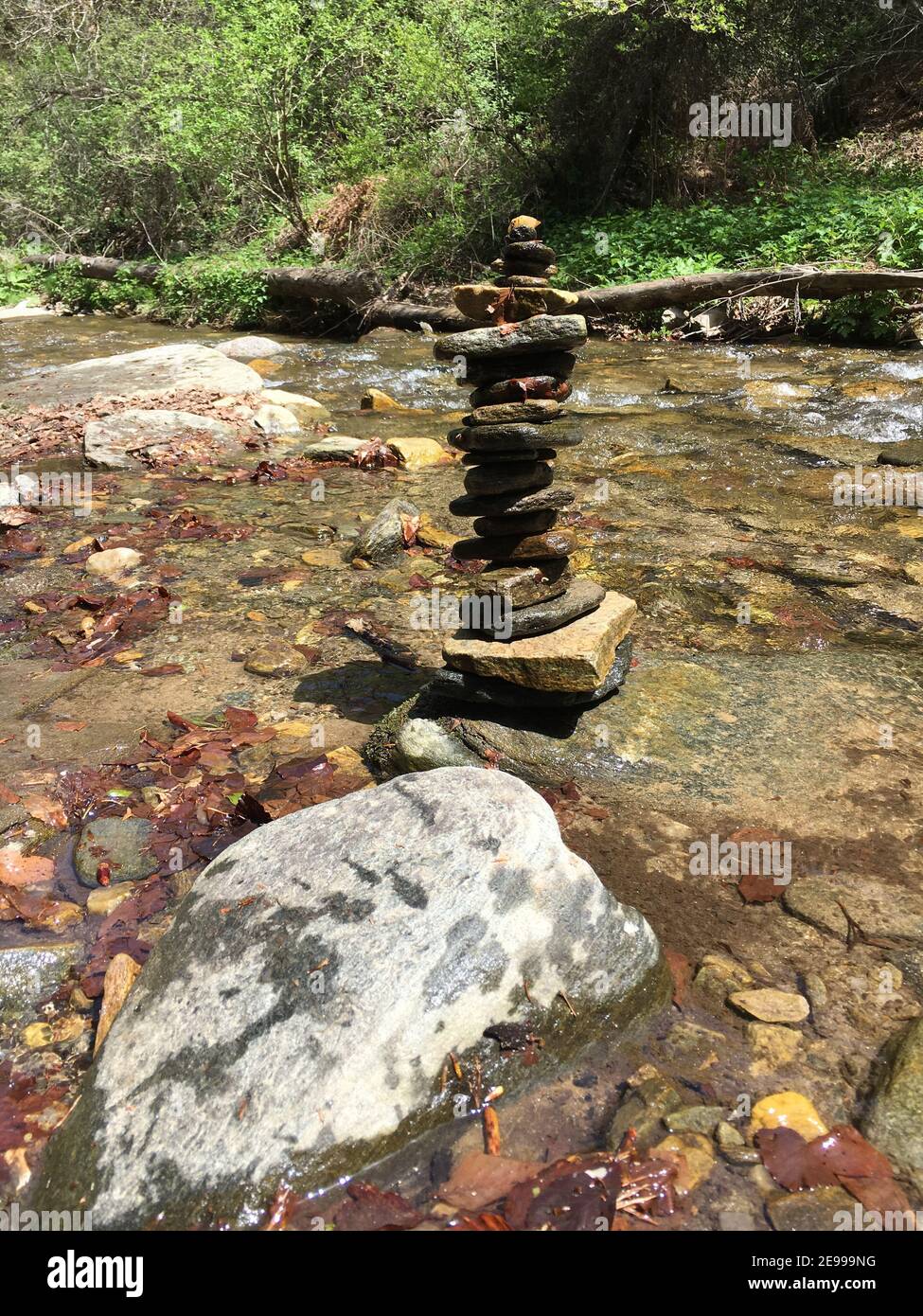 Balanced stones in a easy river in springtime. Stone tower Stock Photo ...
