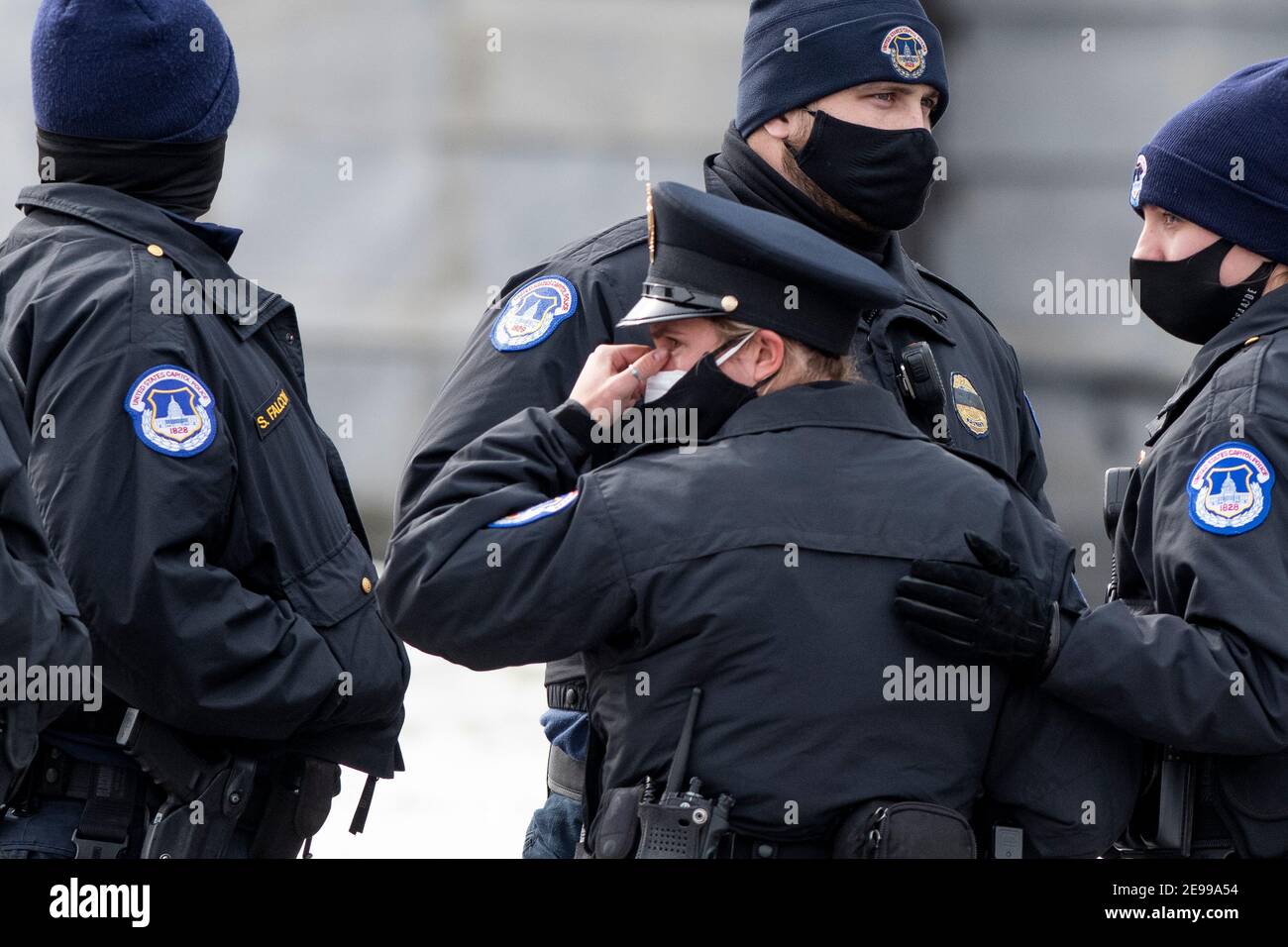 U.S. Capitol police comfort each other following the departure of an ...