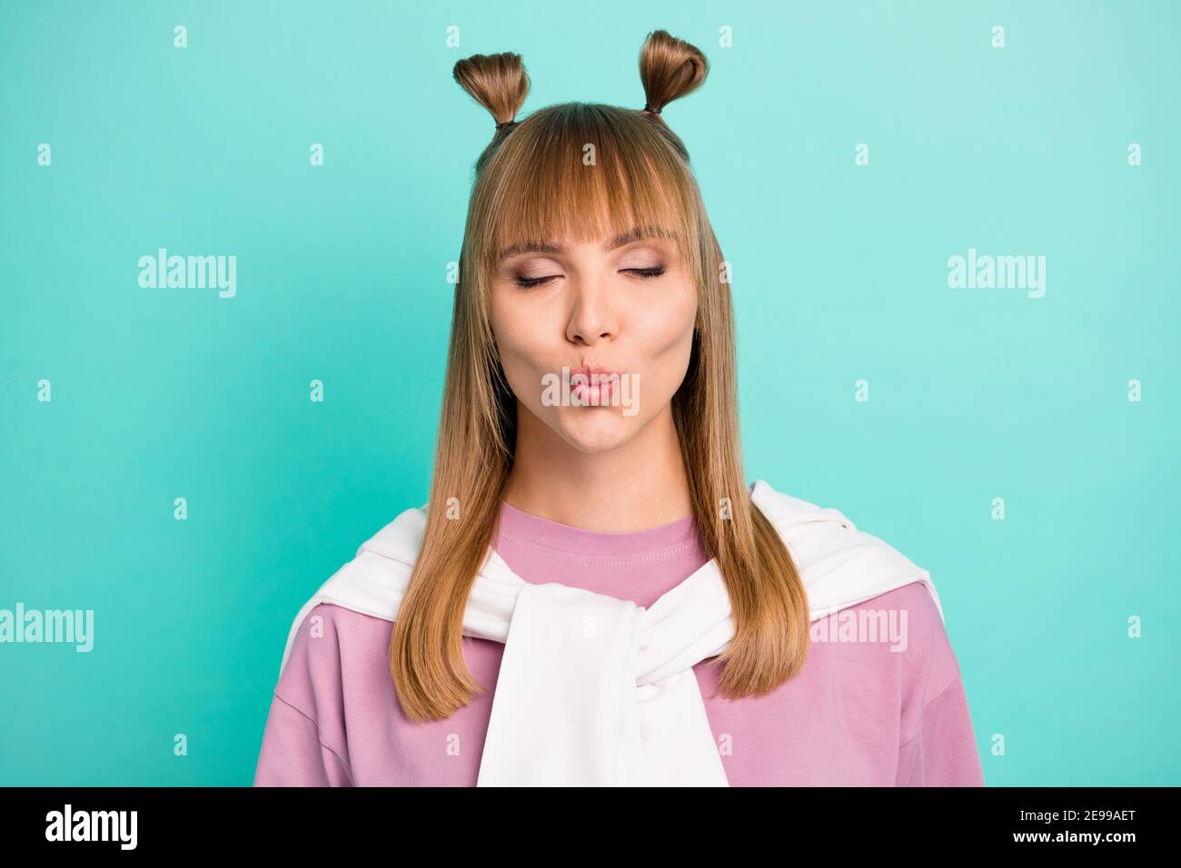 Portrait of young lovely pretty flirty girl with jumper on shoulder ...
