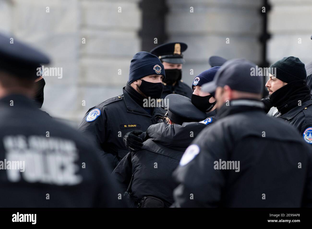 U.S. Capitol police comfort each other following the departure of an ...