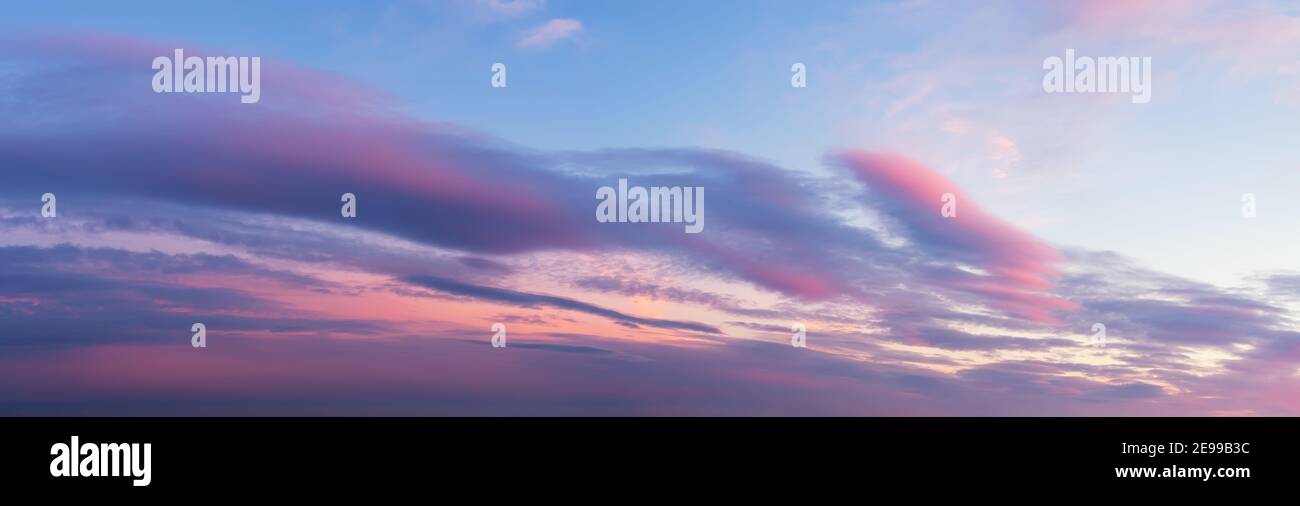 Scenic pink purple clouds against azure sky at sunset. Majestic vanilla ...