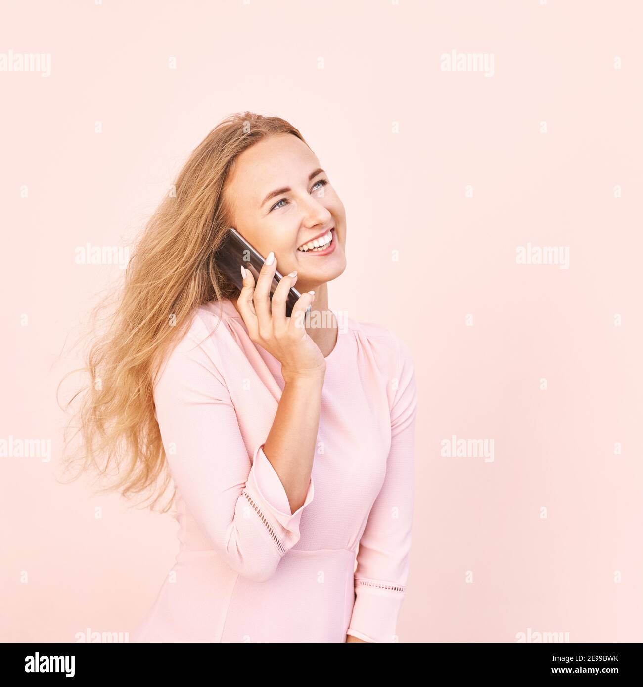 Pretty young woman talking by phone. Happy female person Stock Photo ...