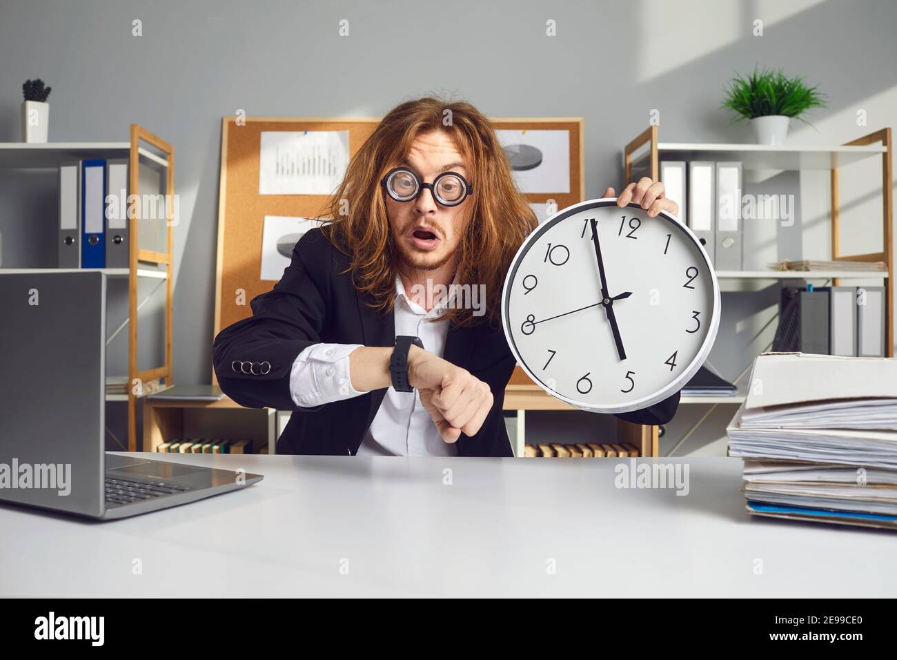 Funny stressed employee working under pressure and trying to cope with deadlines Stock Photo - Alamy