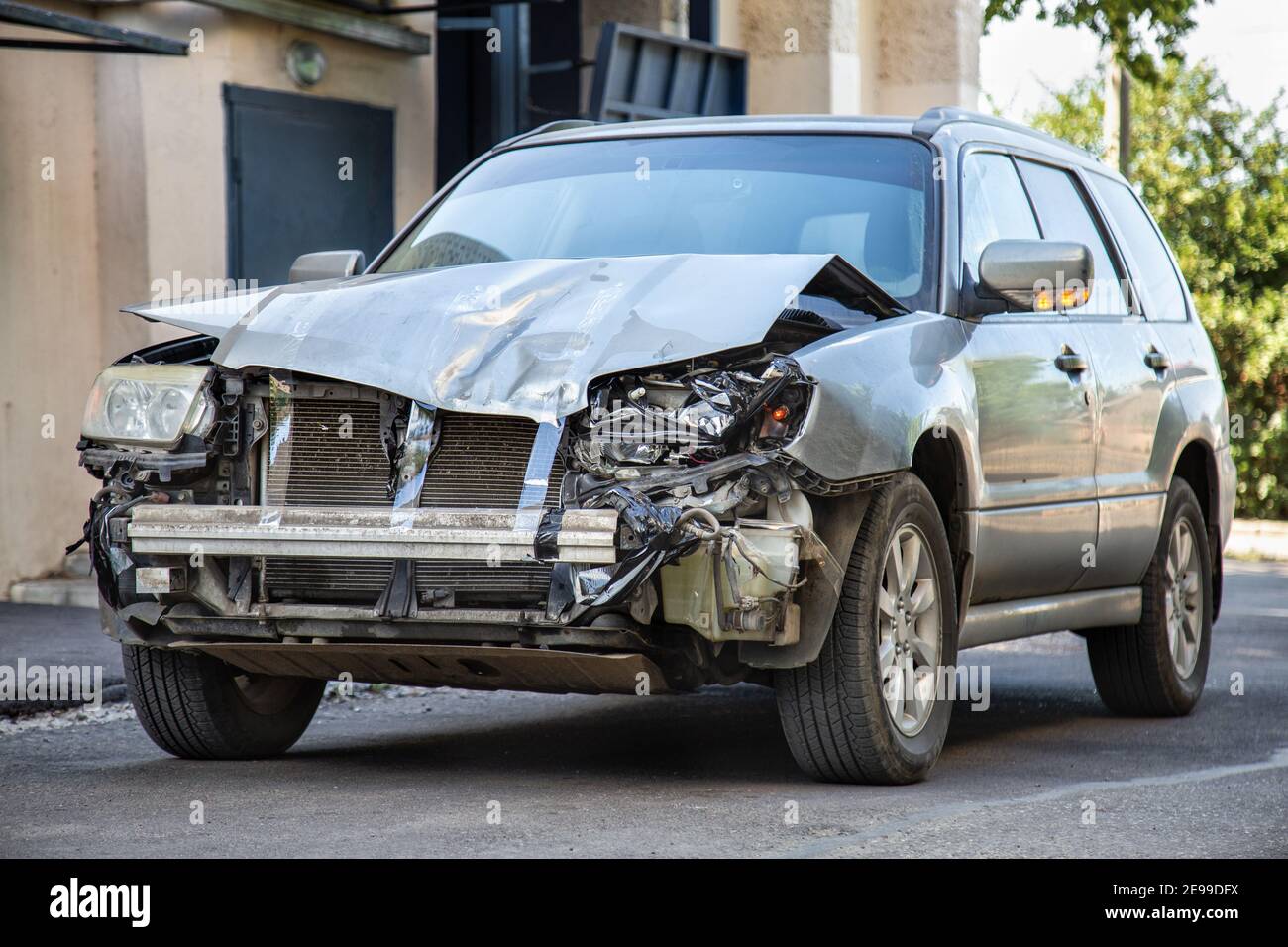 Crashed car in car accident. Broken vehicle after fatal disaster. Road ...