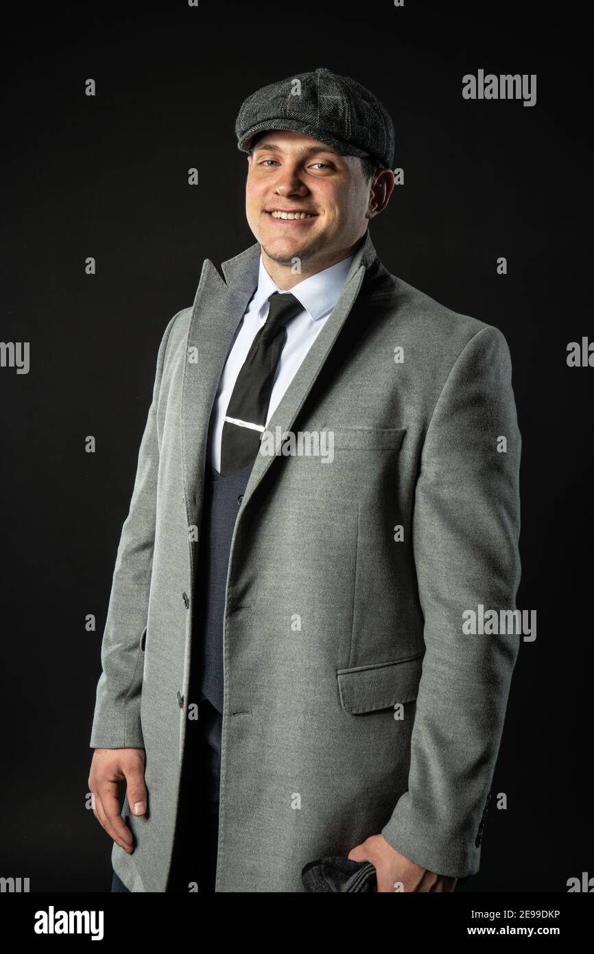 in a coat and a cap Young man three piece suit adult man, attractive ...