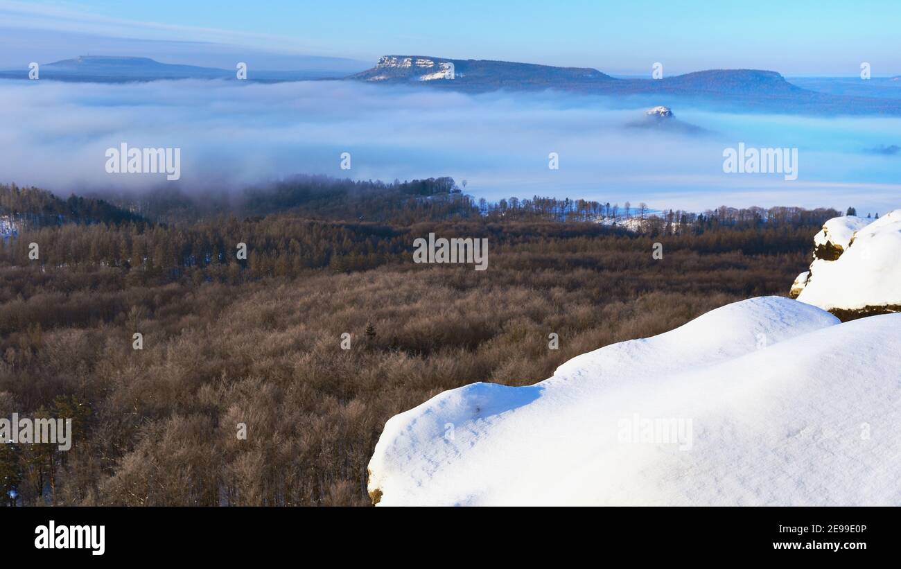 Zirkelstein shinning above freeze mist. Cold winrer morning view. Dry ...