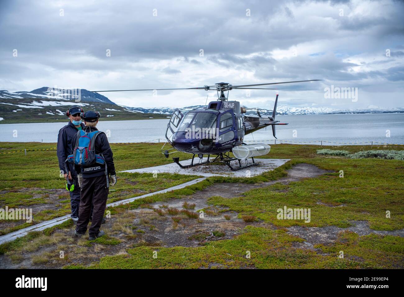 Helicopter Pilot and Crew on the helipad waiting on Passengers Stock ...