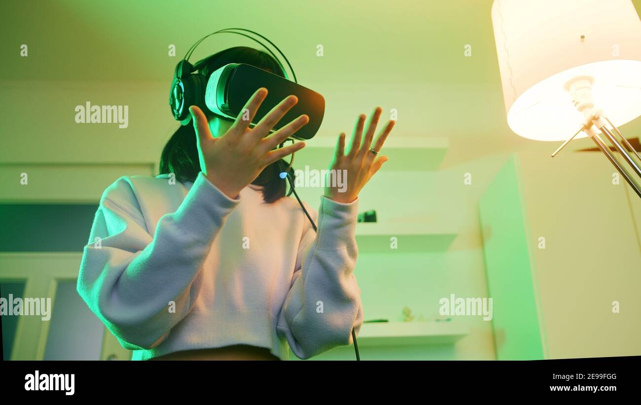 Young asian woman experiencing Virtual reality. . High quality photo ...