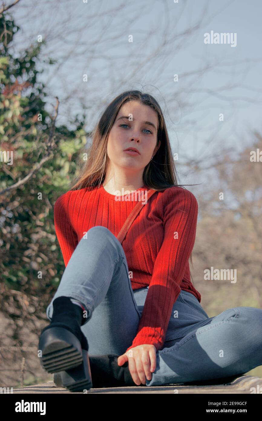 Girl sitting on bench model hi-res stock photography and images - Alamy