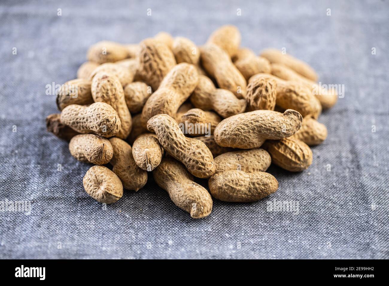 Roasted peanuts. Tasty groundnuts on tablecloth Stock Photo - Alamy