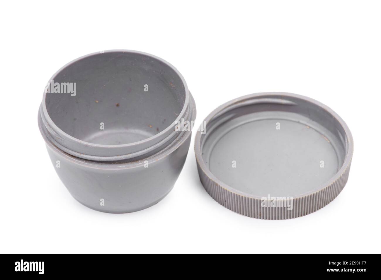 Old plastic jar with lid isolated on white background Stock Photo - Alamy