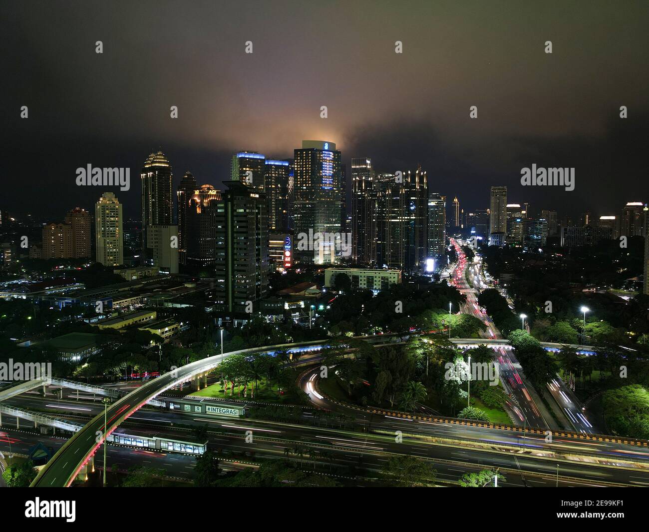 Spectacular nighttime skyline of a big modern city at night. Semanggi ...