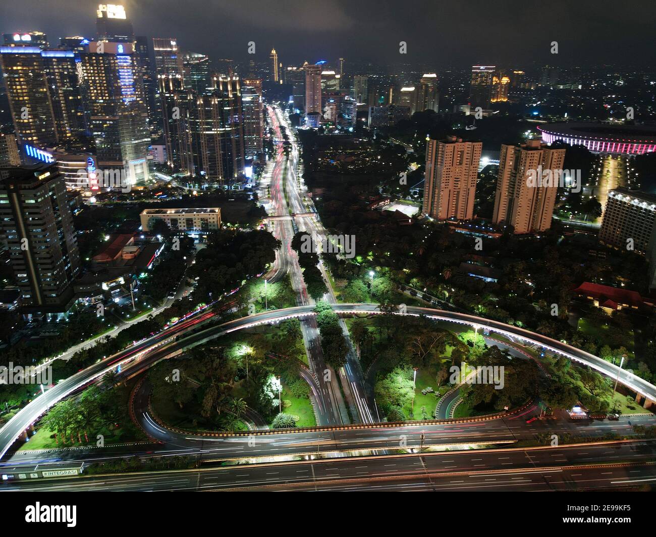 Spectacular nighttime skyline of a big modern city at night. Semanggi ...