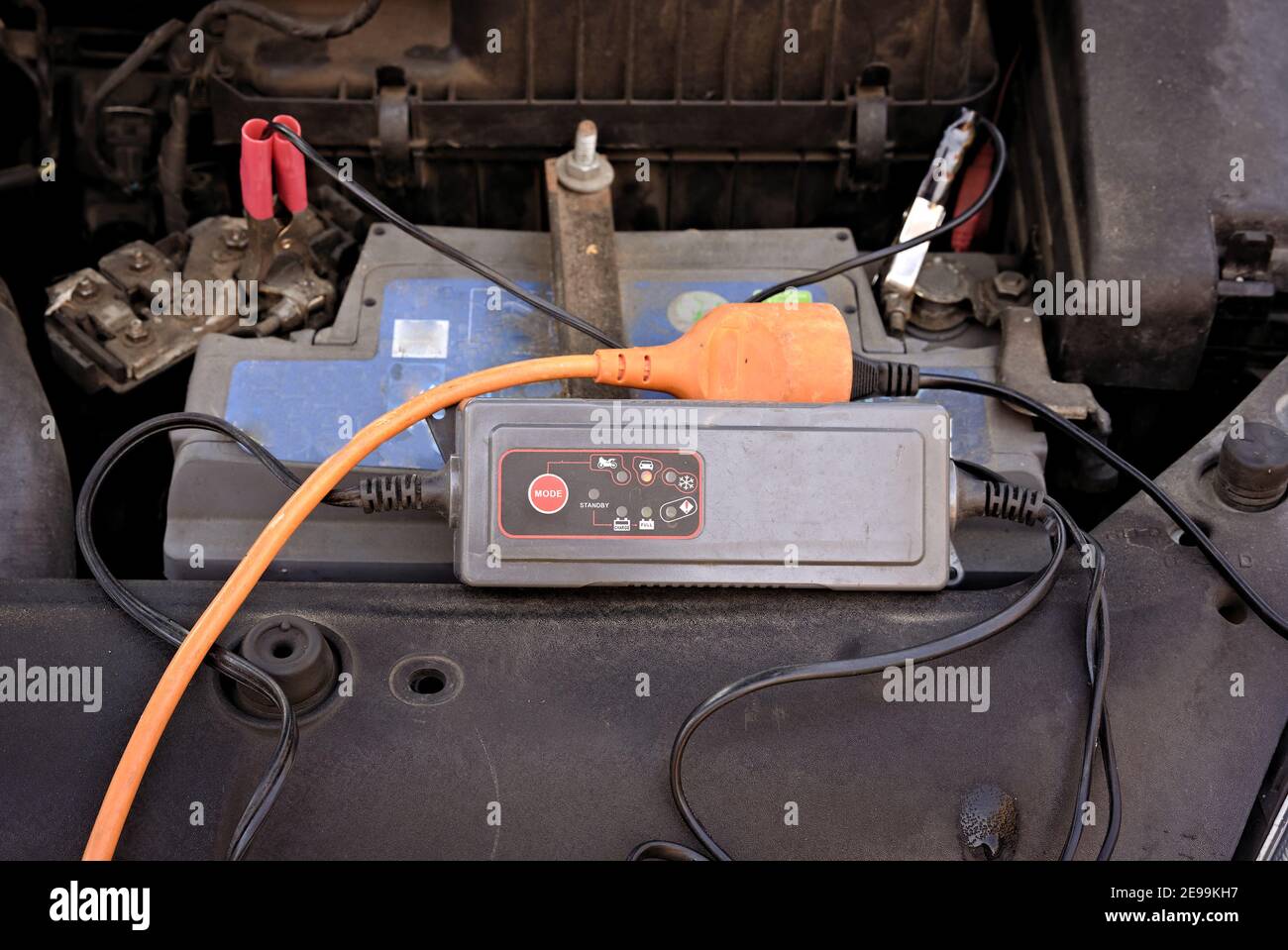 charging the car battery with a small charger Stock Photo - Alamy