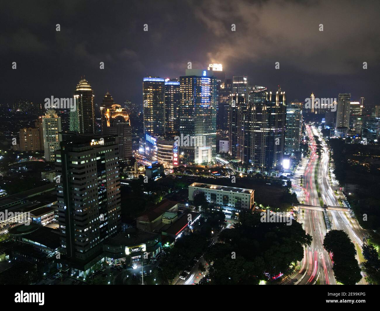 Spectacular nighttime skyline of a big modern city at night. Semanggi ...