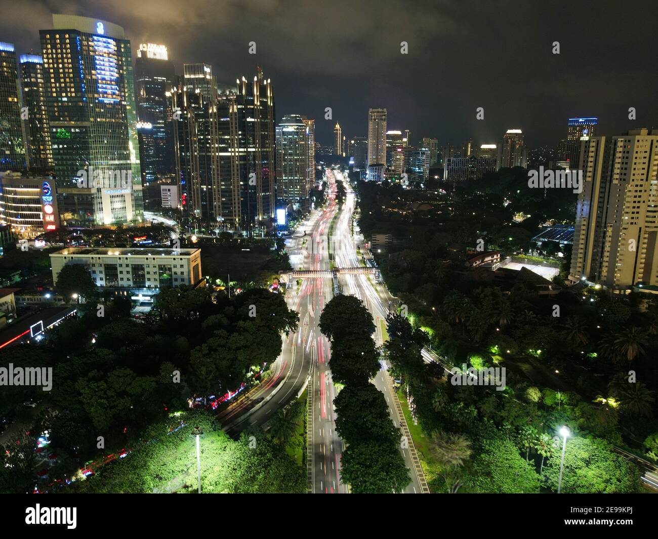 Spectacular nighttime skyline of a big modern city at night. Semanggi ...