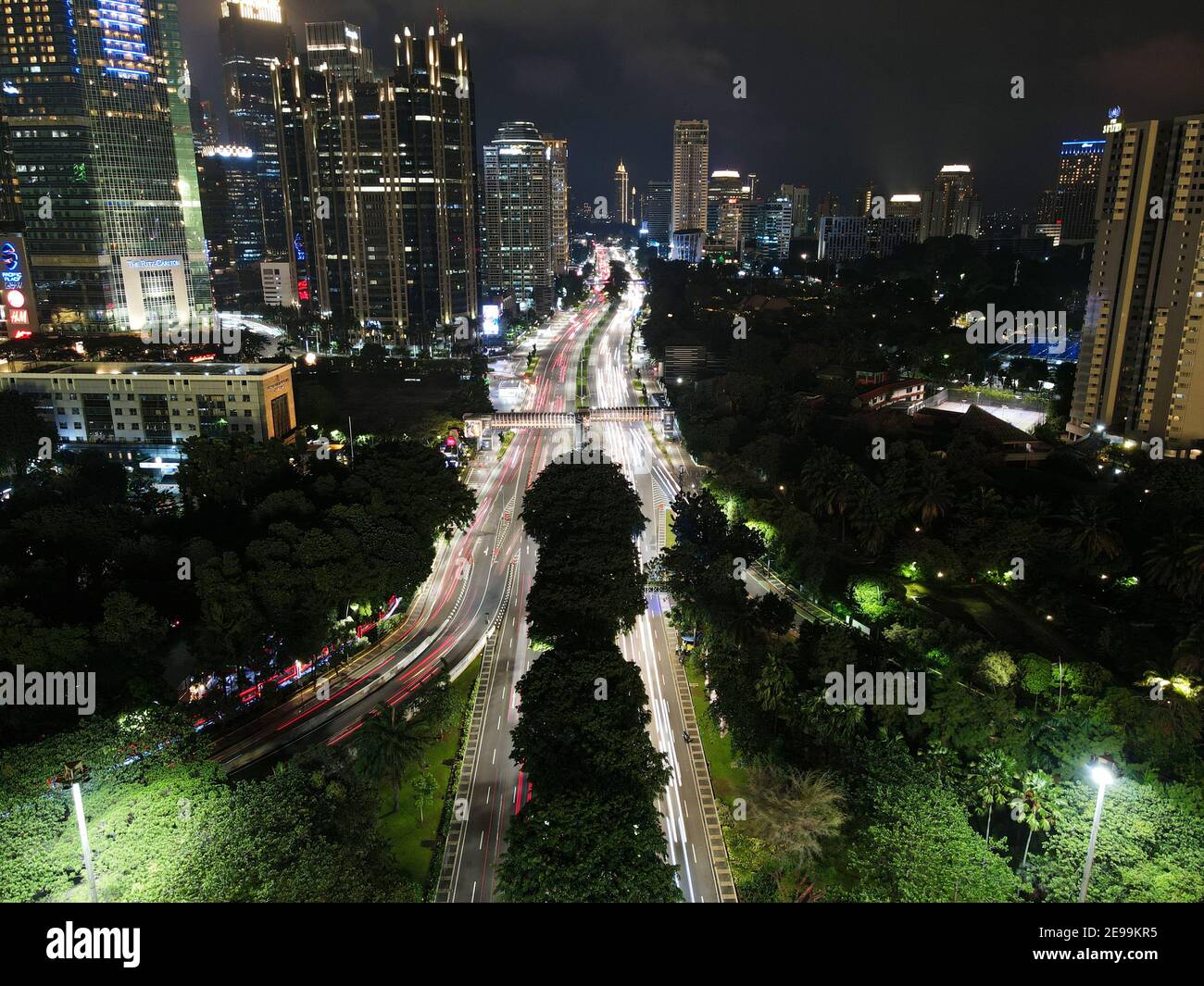 Spectacular nighttime skyline of a big modern city at night. Semanggi ...