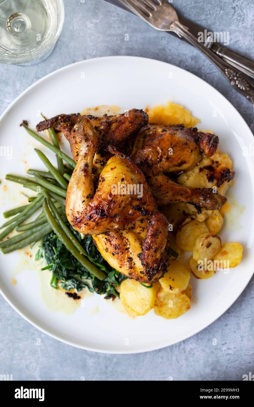 Roasted poussin with potatoes, mashed swede, green beans and creamy ...
