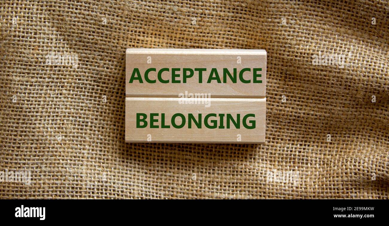 Acceptance and belonging symbol. Wooden blocks with words 'acceptance ...