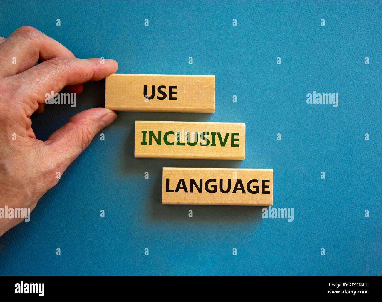 Use inclusive language symbol. Wooden blocks with words 'Use inclusive ...