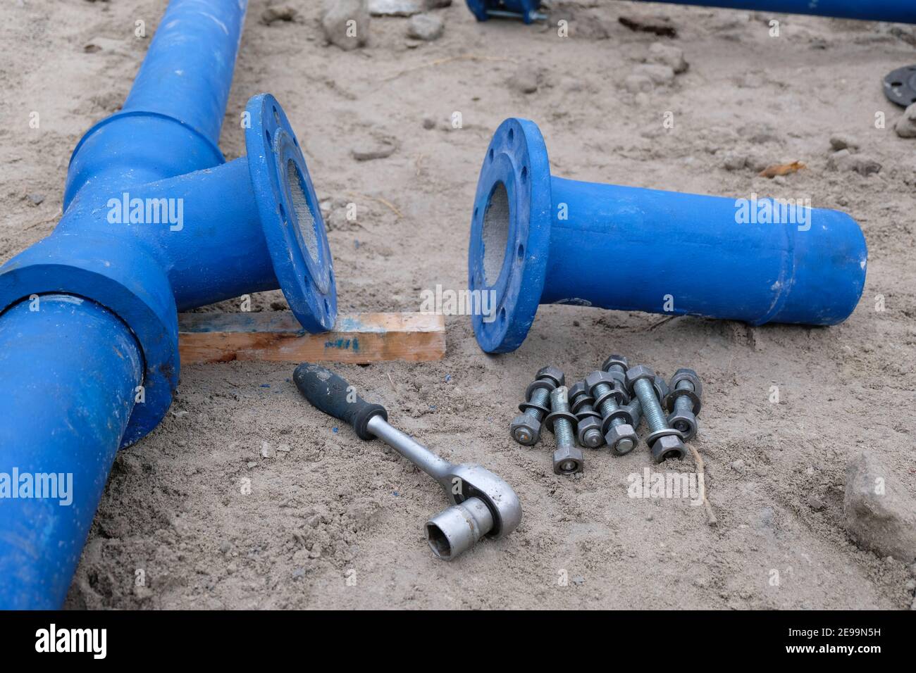 Cast metal pipe connection with flange and tools Stock Photo - Alamy