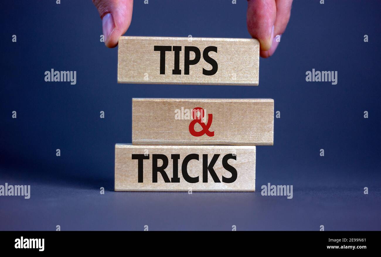 Tips and tricks symbol. Wooden blocks with words 'Tips and tricks ...