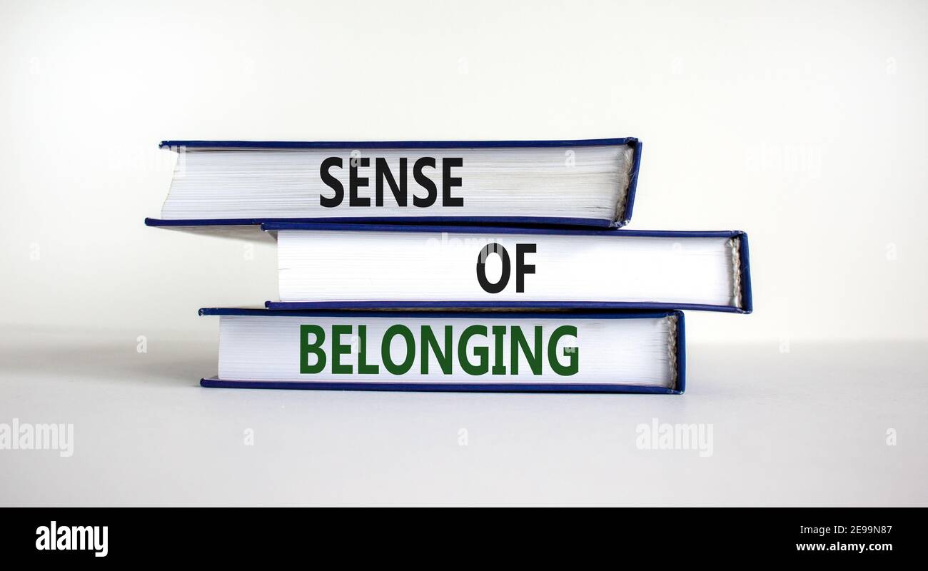 Sense of belonging symbol. Books with words 'sense of belonging' on ...
