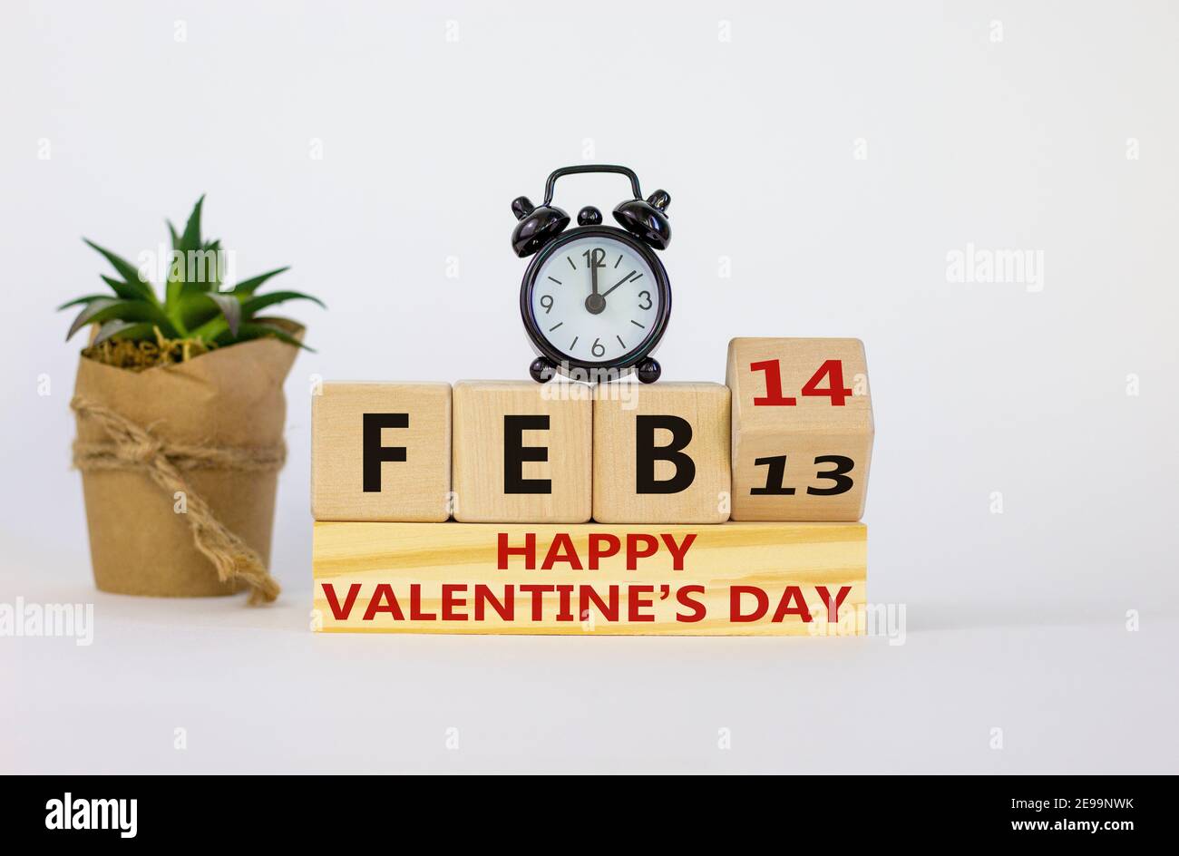February 14 valentines day symbol. Fliped wooden cube with words 'Feb ...
