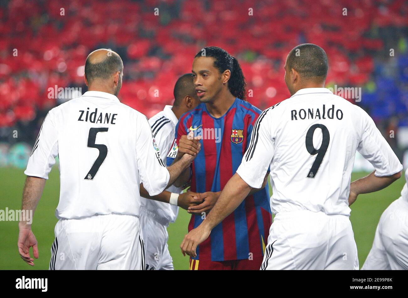 Real Madrid's Zinedine Zidane and Ronaldo shake hands to Barcelona's Ronaldinho during the ...
