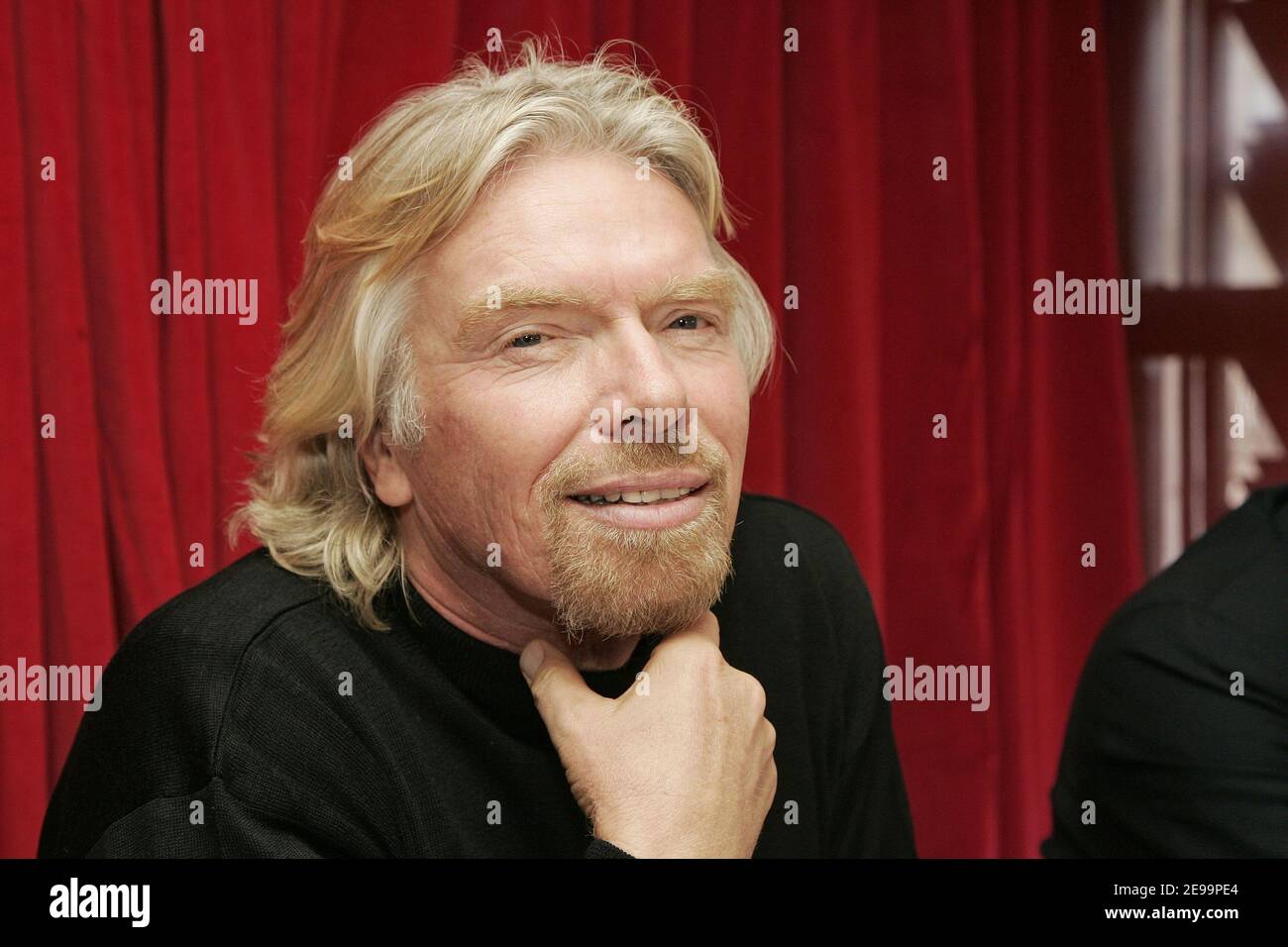 Sir Richard Branson poses during a photocall to launch the phone ...