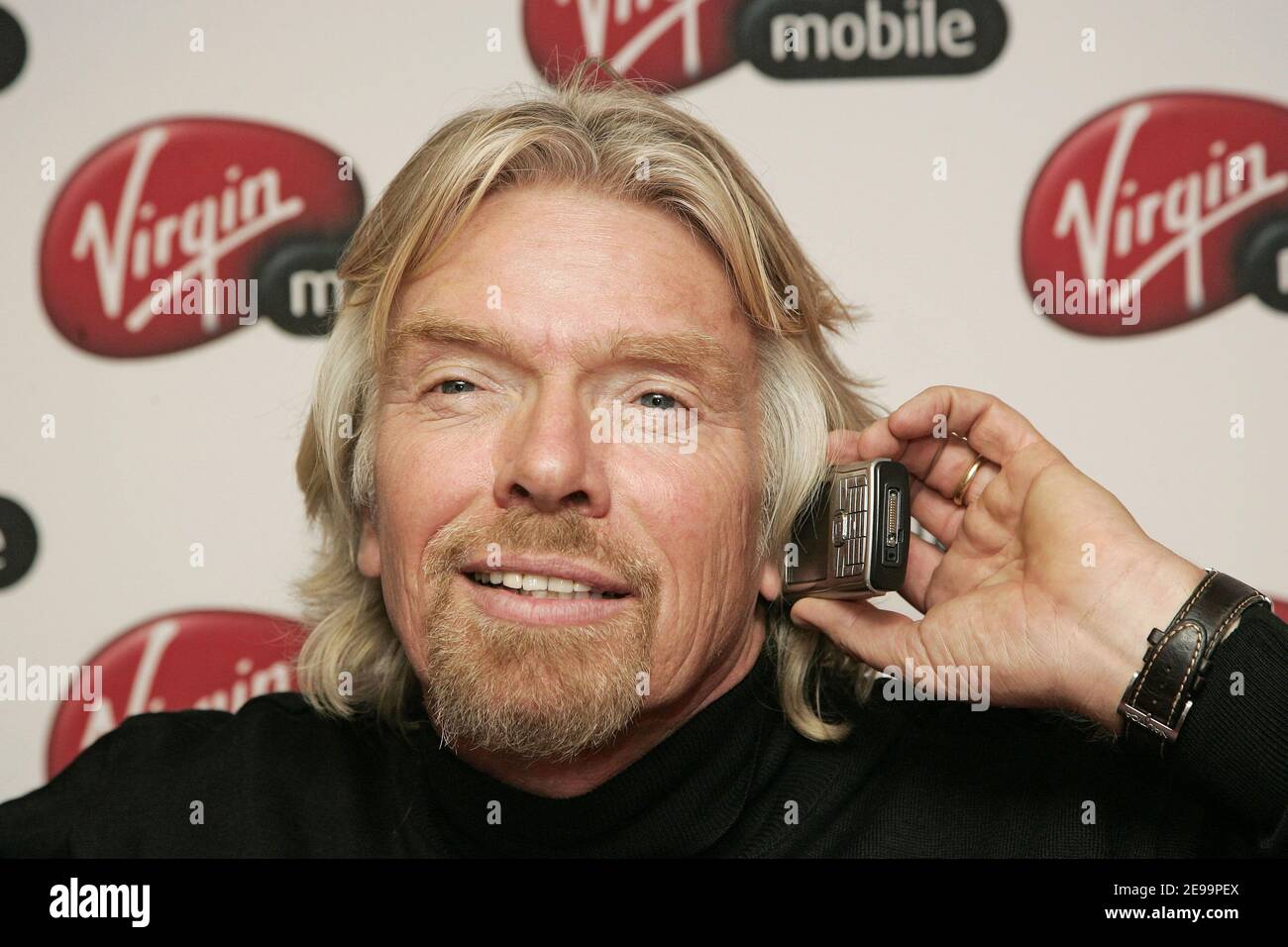 Sir Richard Branson poses during a photocall to launch the phone ...