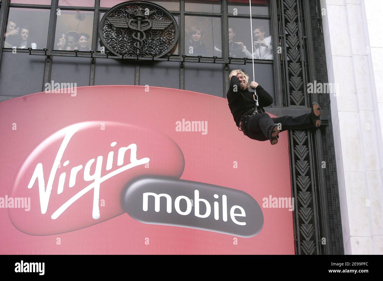 Sir Richard Branson poses during a photocall to launch the phone ...