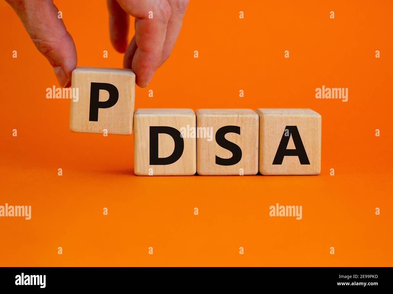 PDCA, plan do check act symbol. Wooden cubes with words 'PDCA, plan do ...