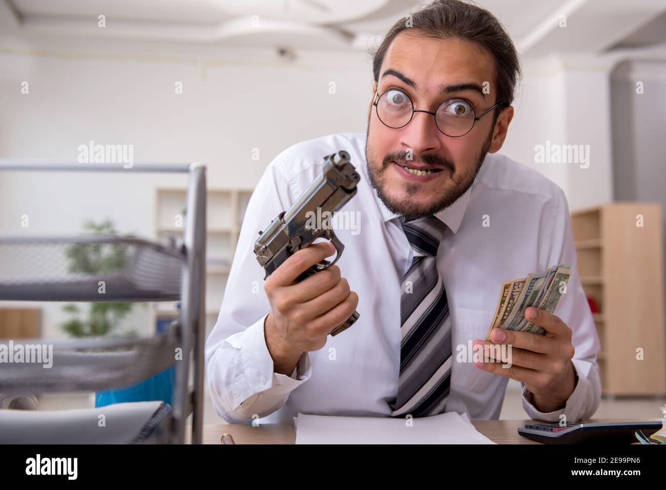 Angry bookkeeper in bankruptcy concept Stock Photo - Alamy