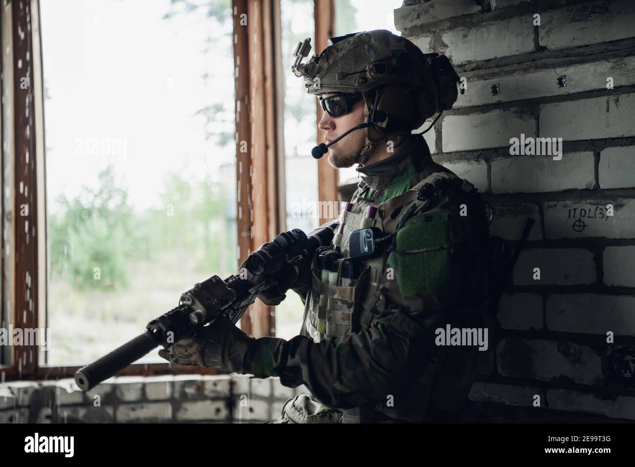 Weapon inspection while waiting on a spot. Military man checks his ...