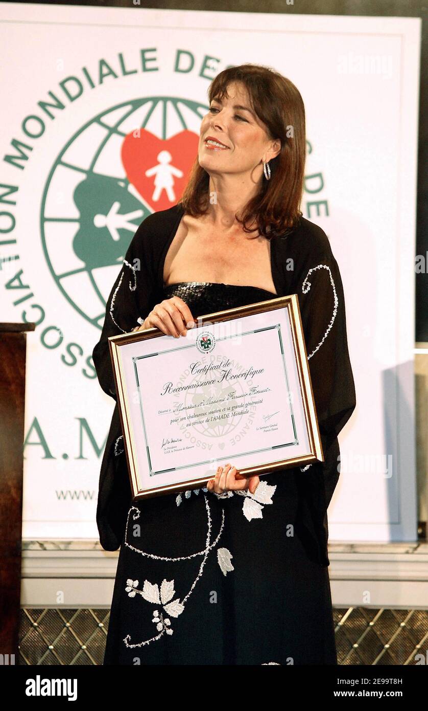 Princess Caroline of Hanover shows the certificate she will give to ...