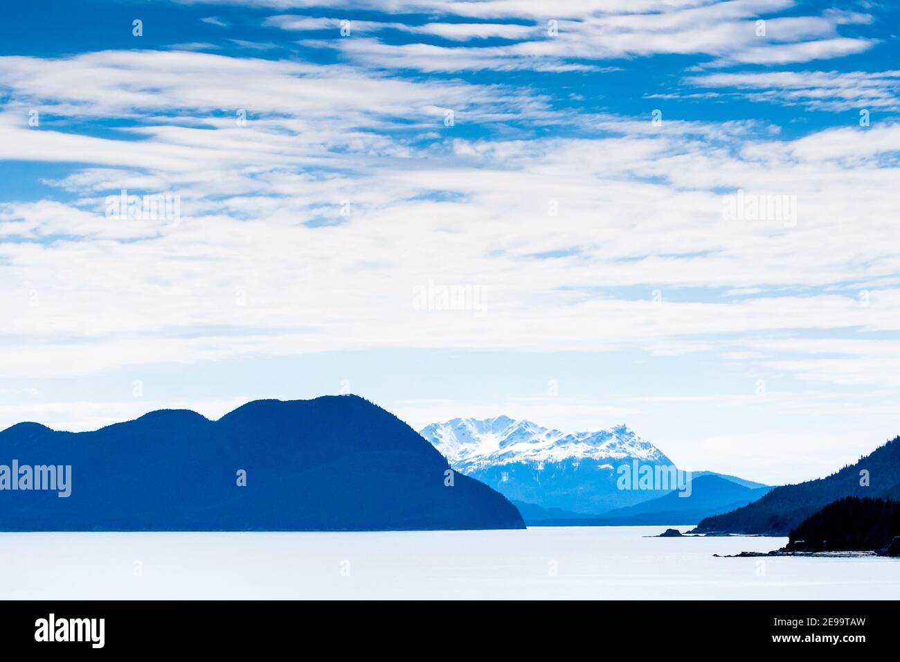 Snow-capped mountains along the coast of southern Alaska Stock Photo ...