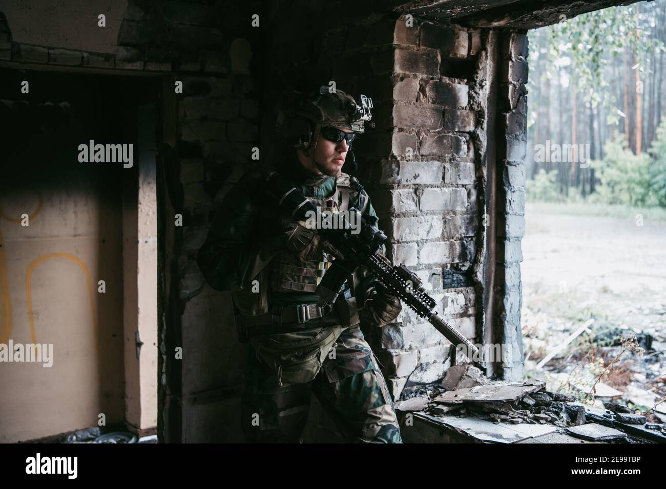 Front view close up of caucasian soldier with a rifle stand guard ...