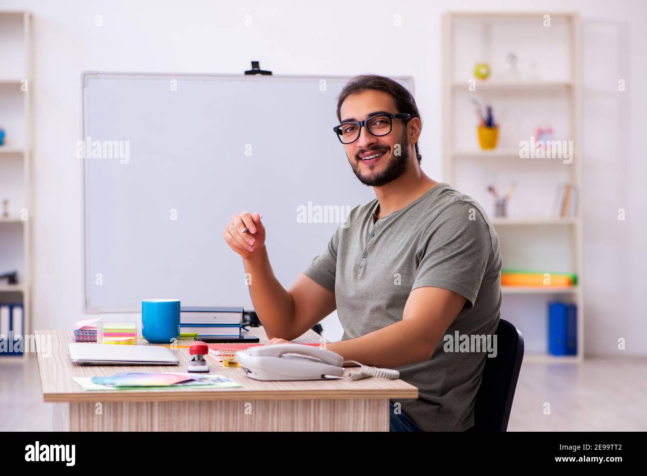 Young designer working in the office Stock Photo - Alamy