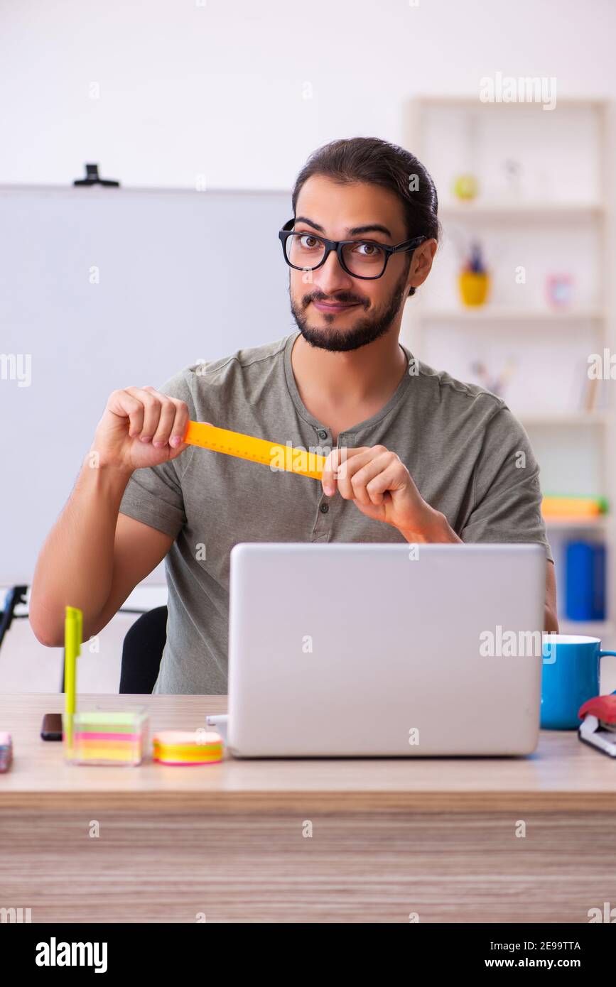 Young designer working in the office Stock Photo - Alamy