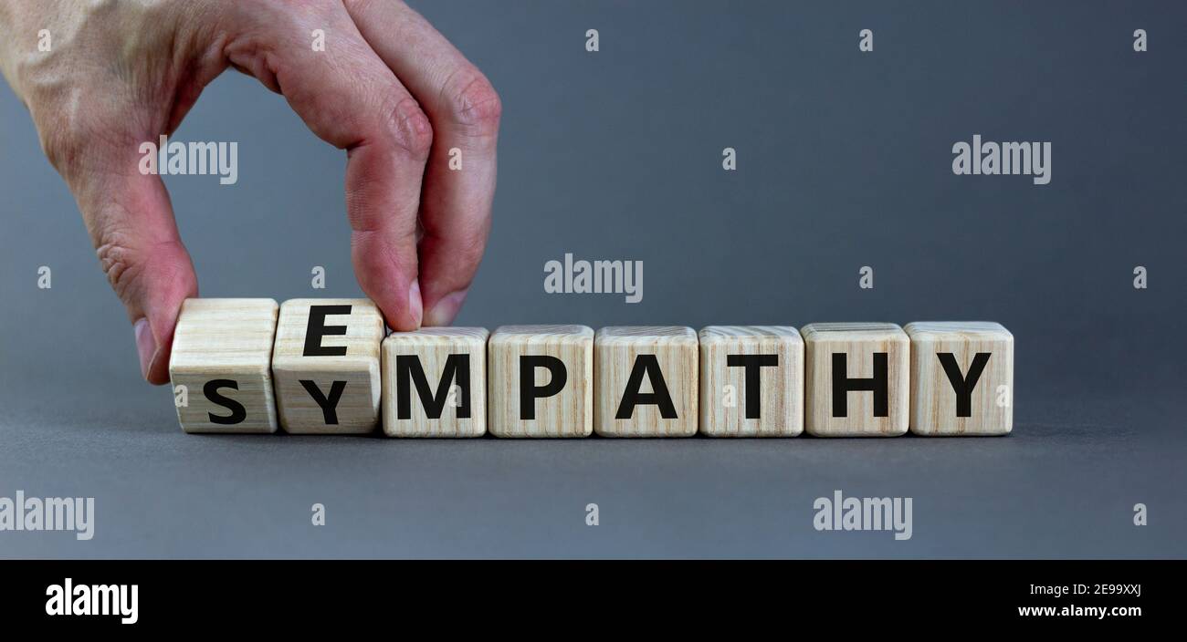 Sympathy or empathy symbol. Businessman turns wooden cubes and changes ...