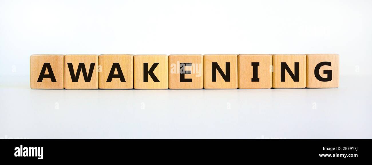 Awakening symbol. Wooden cubes with the word 'awakening'. Beautiful ...