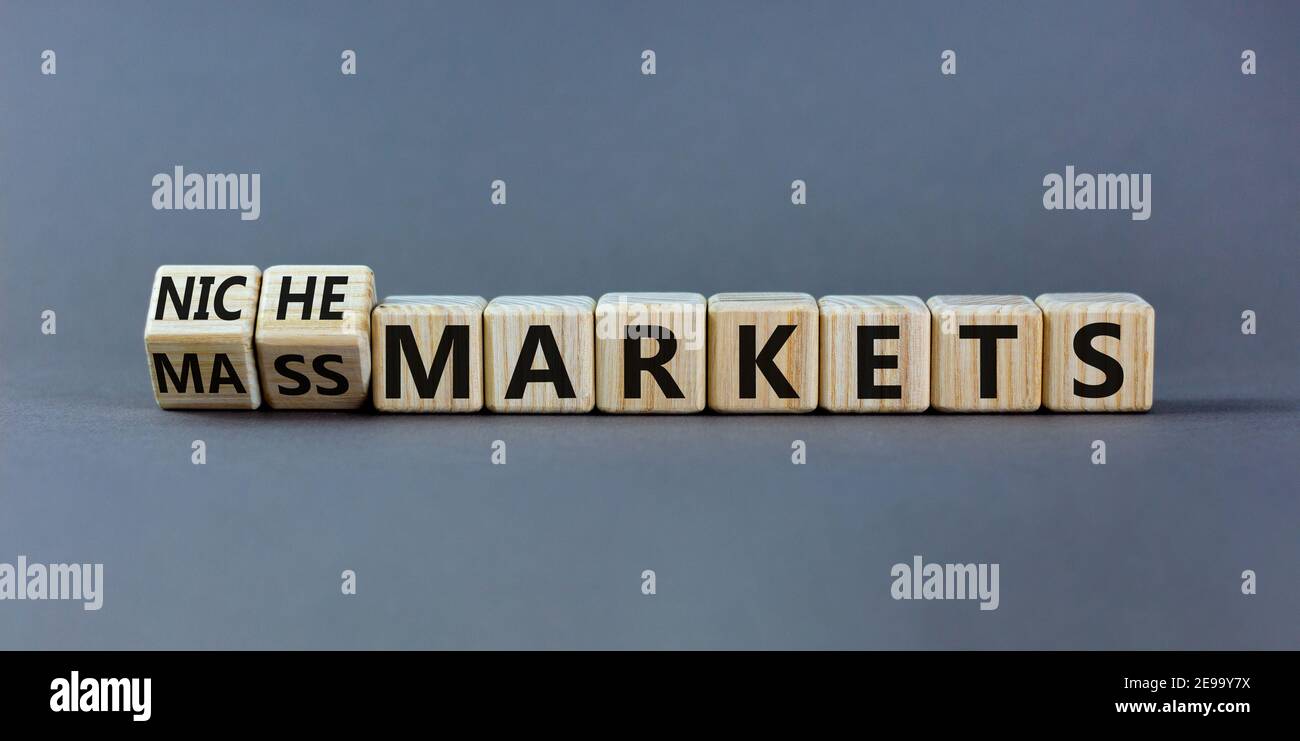 Mass or niche markets symbol. Turned wooden cubes and changed words ...