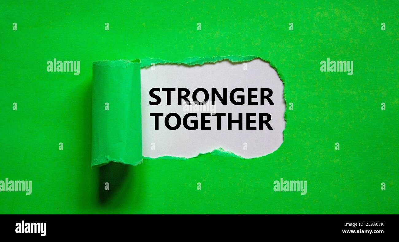 Stronger together symbol. Words Stronger together appearing behind torn ...