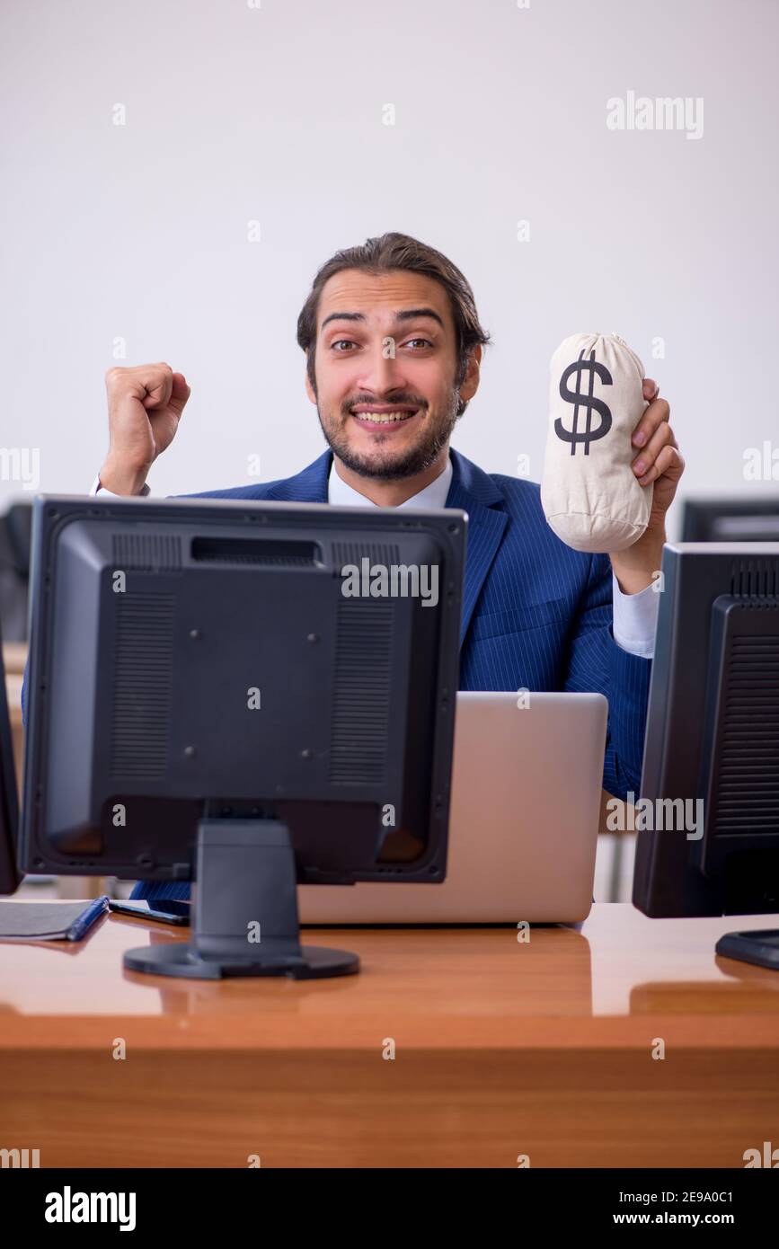 Young employee in remuneration concept Stock Photo - Alamy