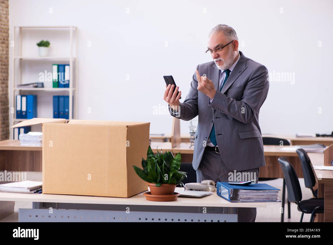 Old employee being fired from his work Stock Photo - Alamy