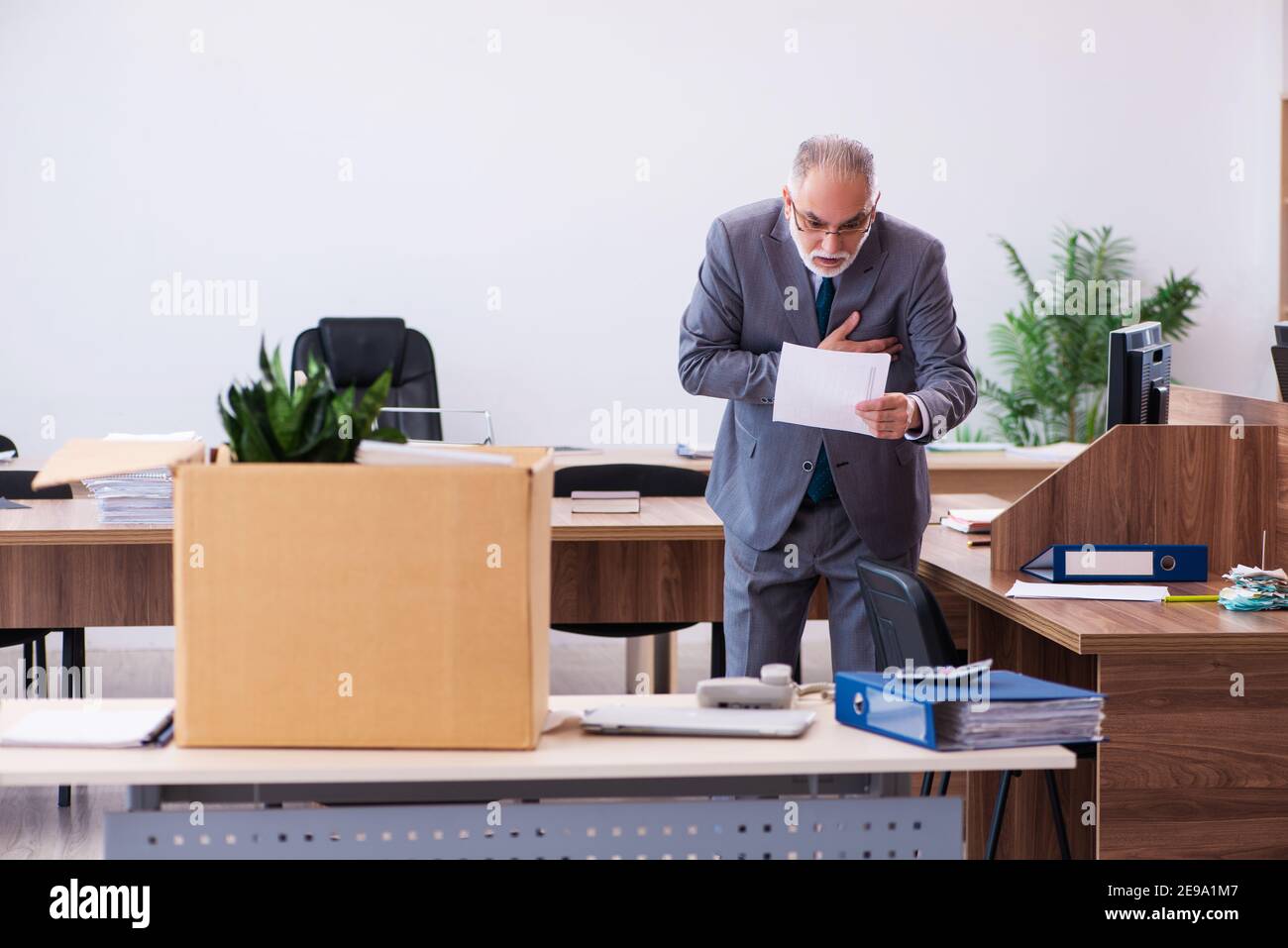 Old employee being fired from his work Stock Photo - Alamy